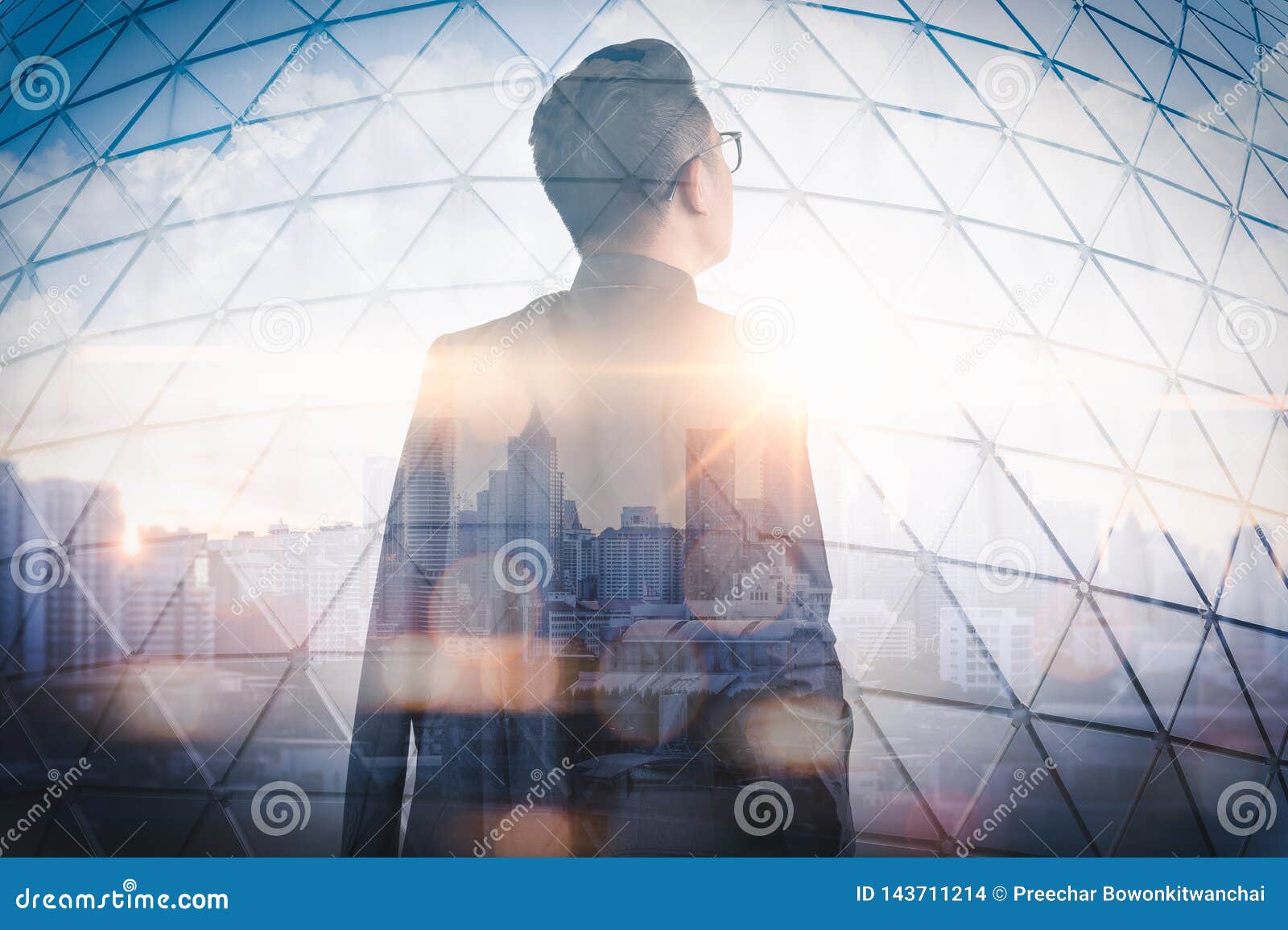 The Double Exposure Image Of The Businessman Standing Back During Sunrise Overlay With Cityscape