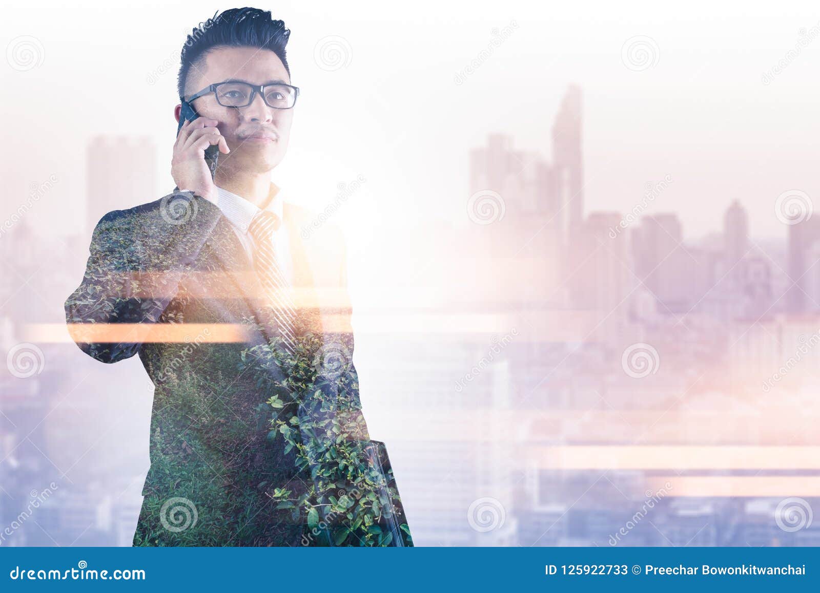 The Double Exposure Image Of The Businessman Using A Smartphone During Sunrise Overlay With