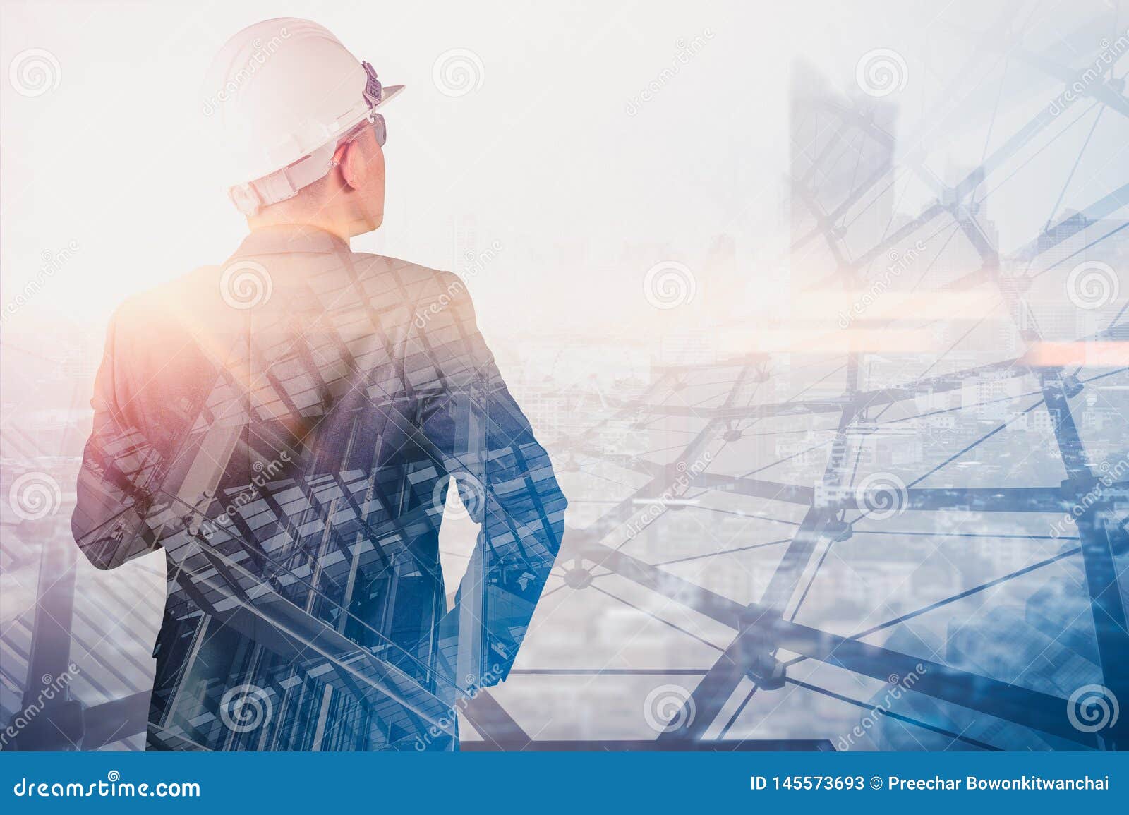 The Double Exposure Image of the Engineer Standing Back during Sunrise ...