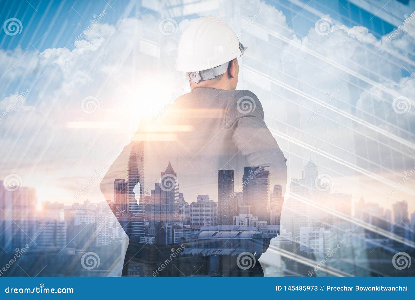 The Double Exposure Image of the Engineer Standing Back during Sunrise ...