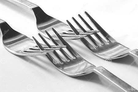 Double forks embrace stock image. Image of table, supper - 47409