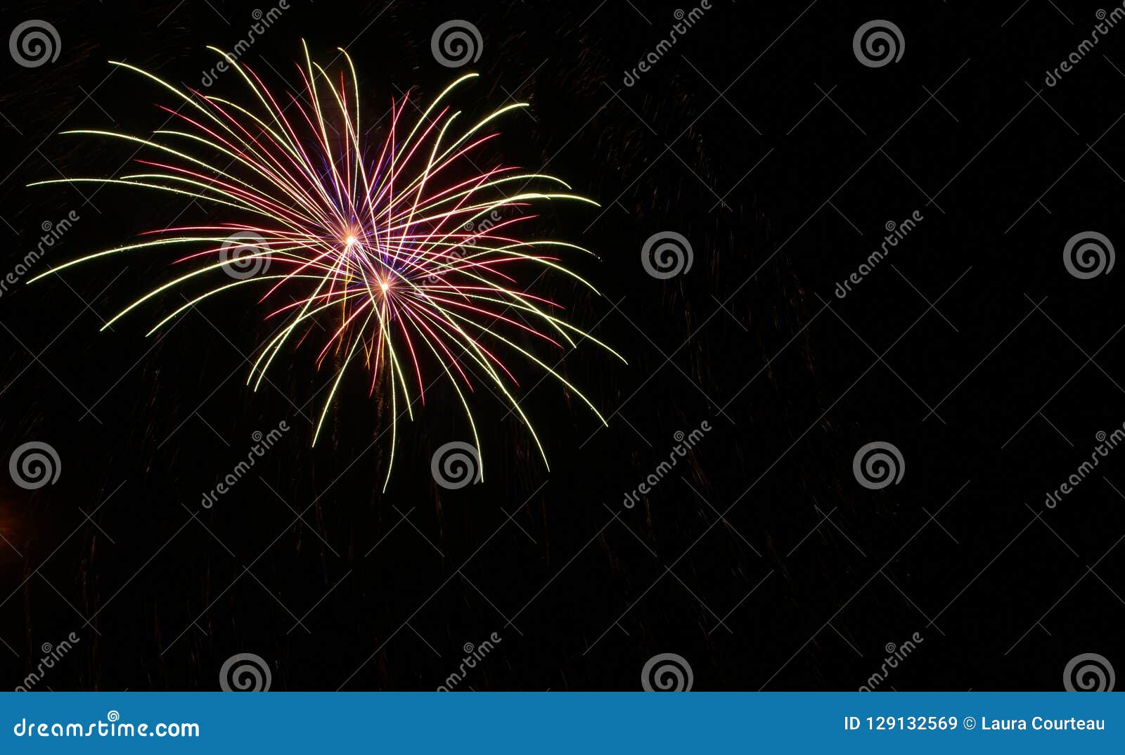 Double Green and Red Starburst Firework Against a Black Sky on the ...
