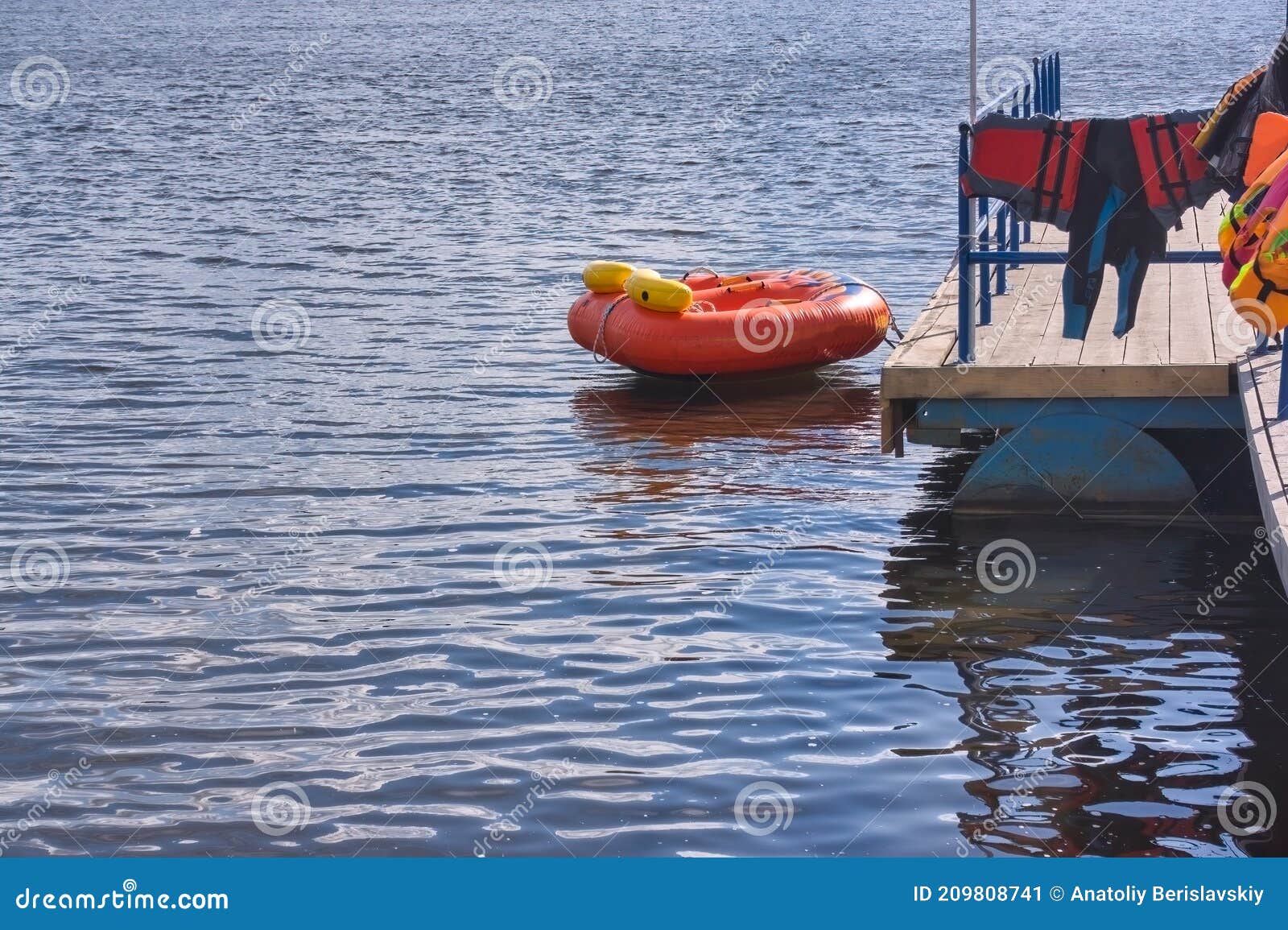 Double Inflatable Raft of Orange Color on the Water Surface Stock Image ...