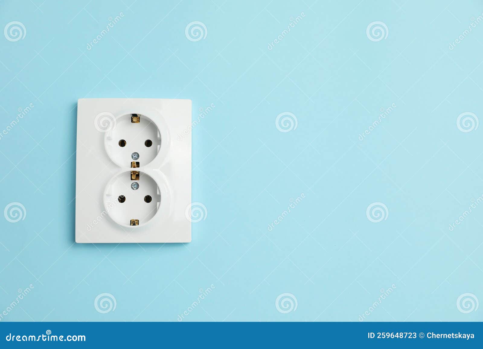 Double Power Socket on Light Blue Wall, Space for Text. Electrical ...