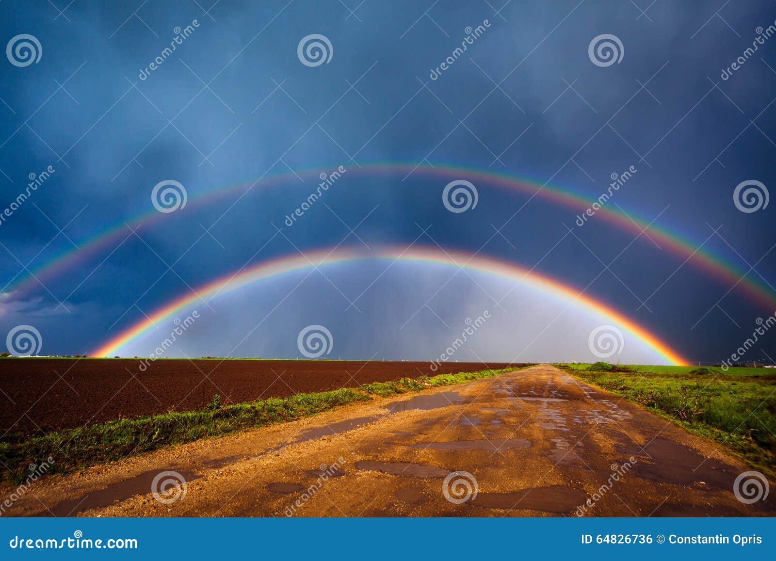 Double rainbow over field stock photo. Image of country - 64826736