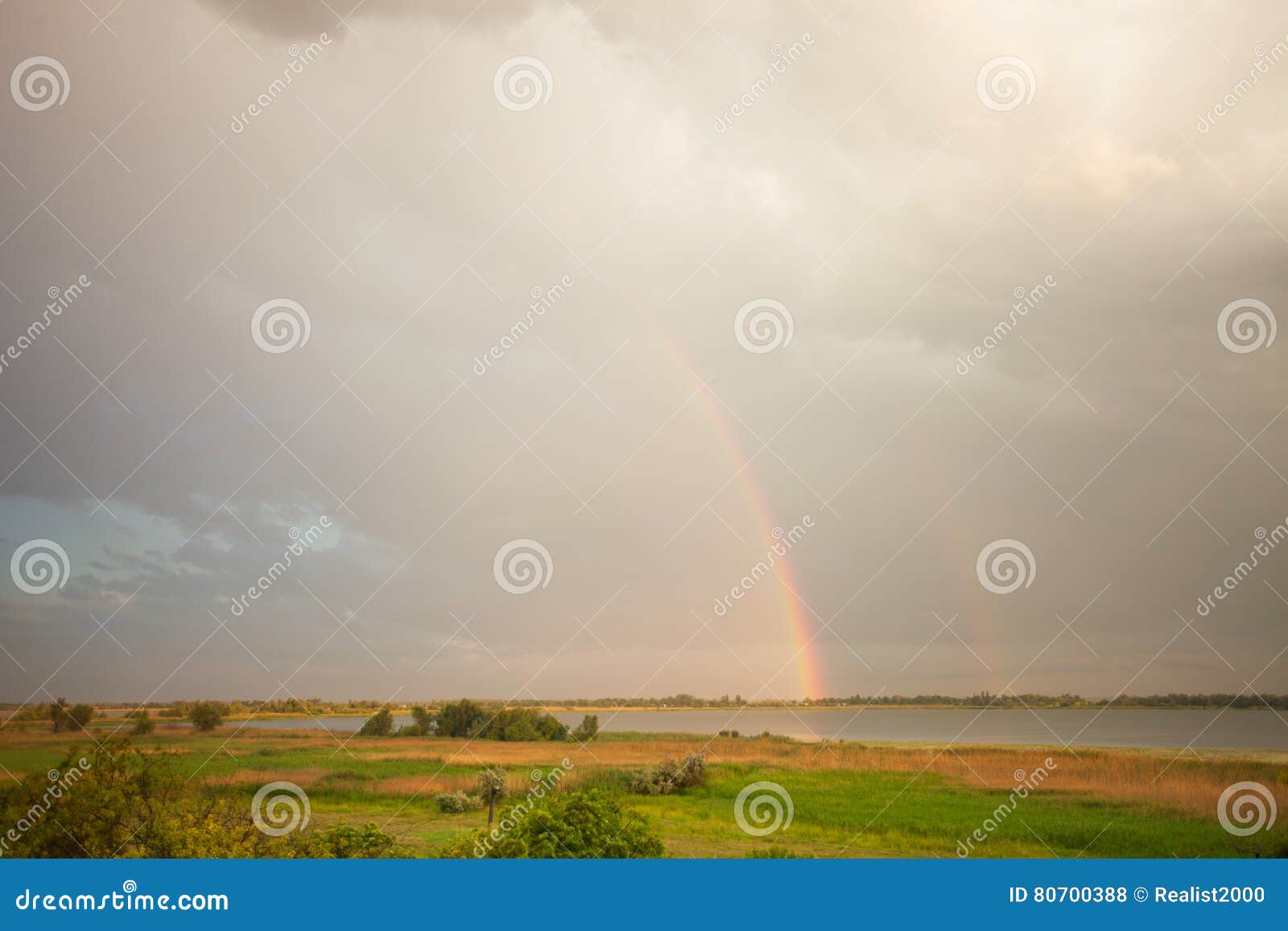 Double rainbow over a lake stock photo. Image of environment - 80700388