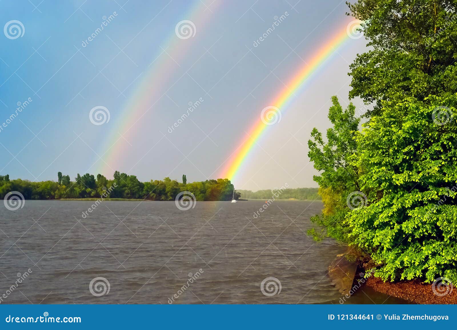 Double Rainbow Over the River after the Rain, in the Foreground Green ...