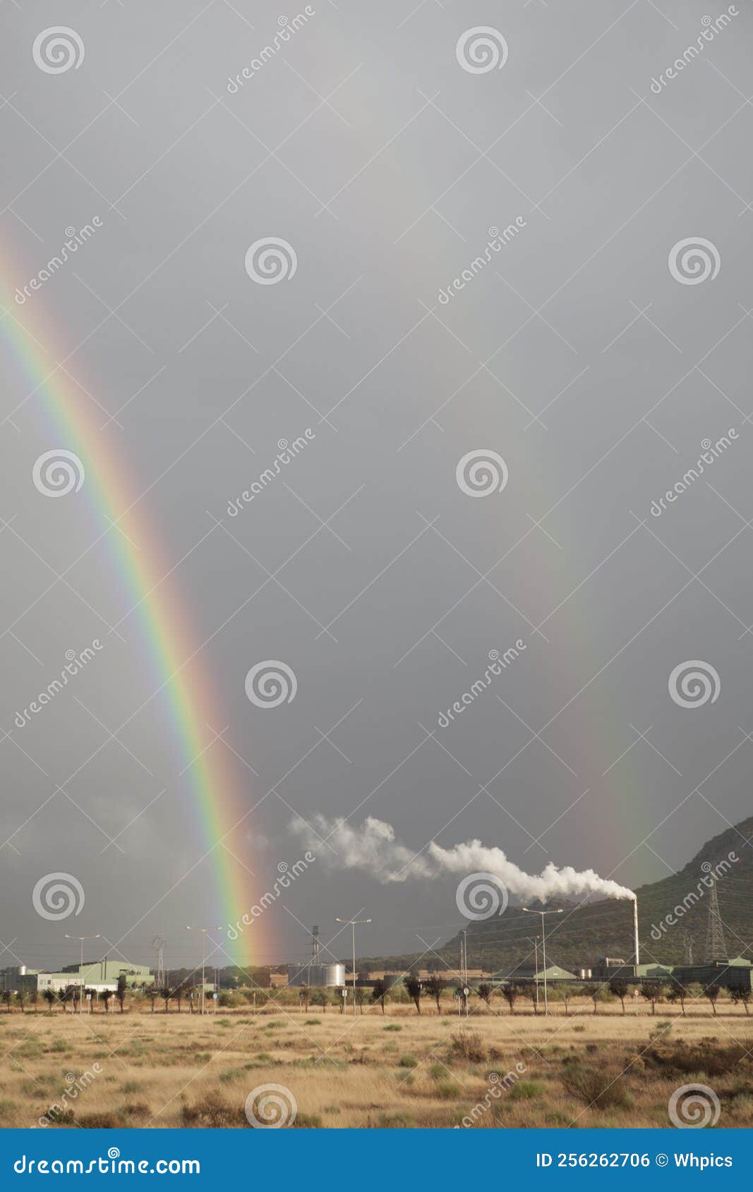 Double Rainbow Rising Over an Industrial Area Stock Photo - Image of ...