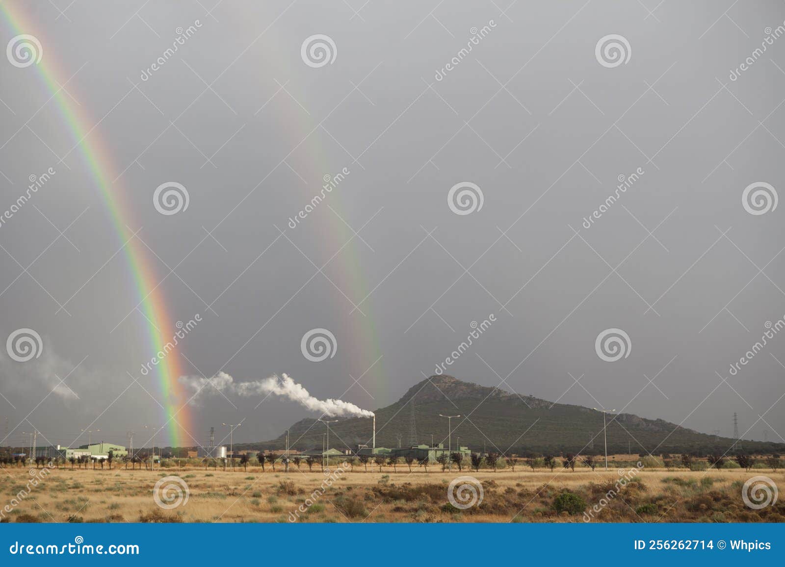 Double Rainbow Rising Over an Industrial Area Stock Photo - Image of ...