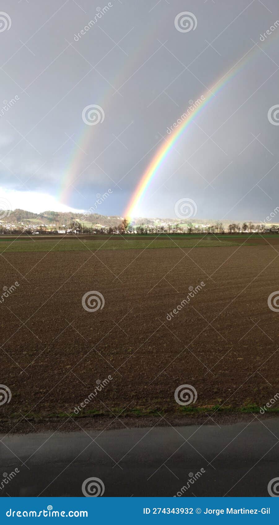 Double rainbow in the sky stock photo. Image of rainbow - 274343932