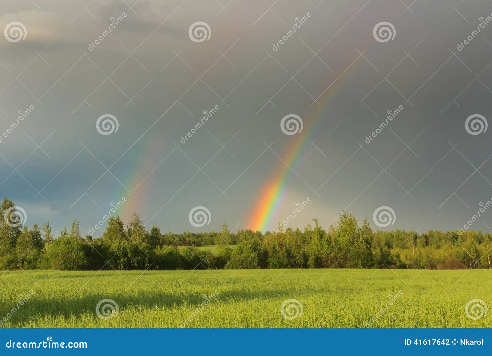 Double Rainbow in a Sky after Storm Stock Photo - Image of dark, meadow ...