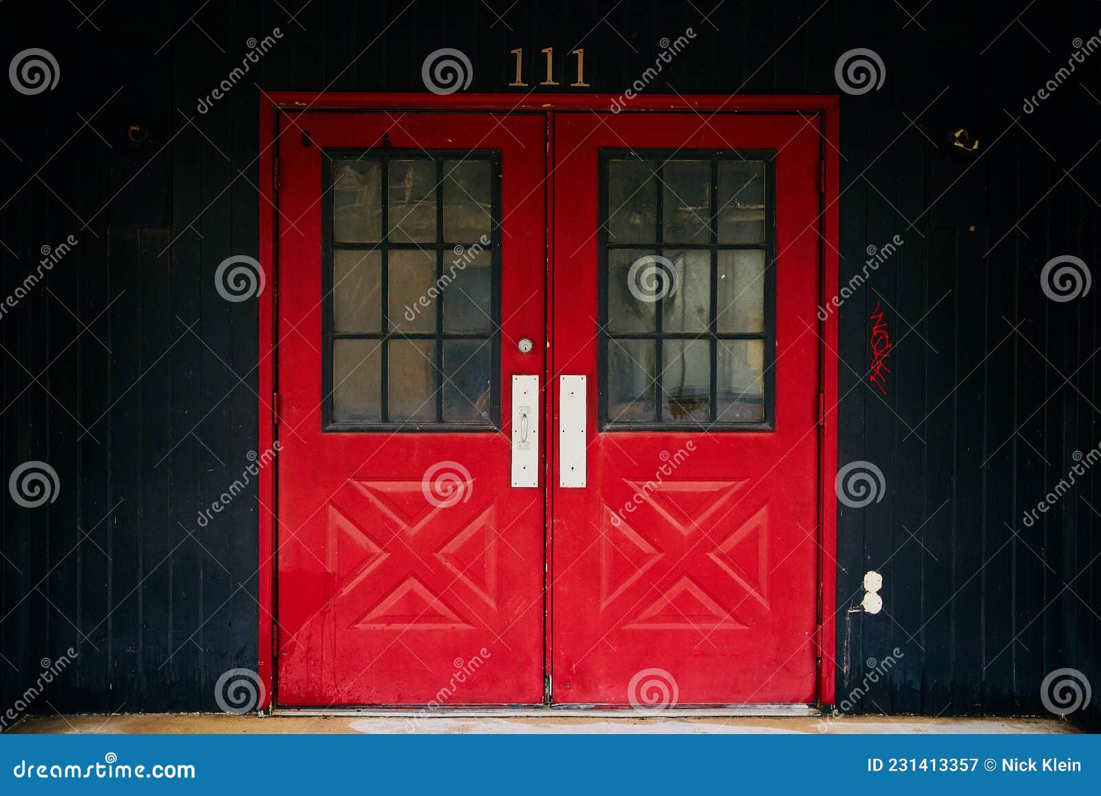 Double Red Doors To Building 111 with Black Paneling Stock Image ...