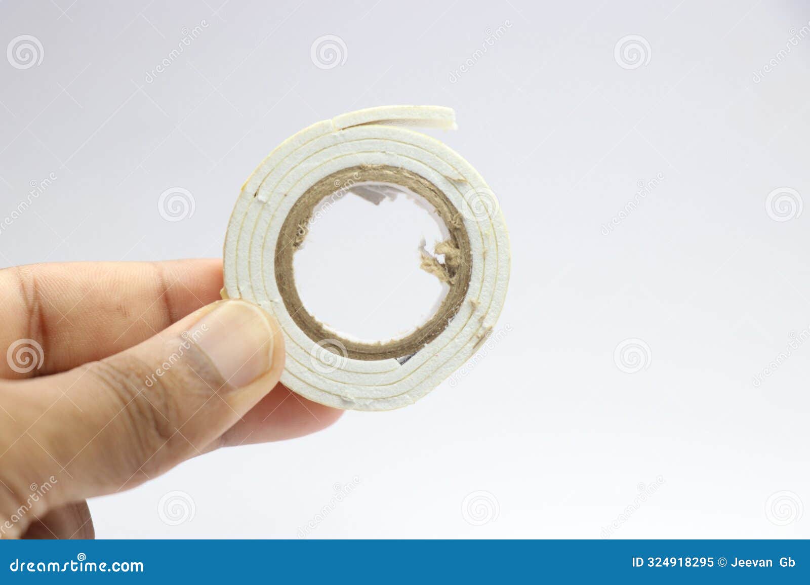 Double Sided Adhesive Tape Used To Join Two Objects Held in the Hand ...