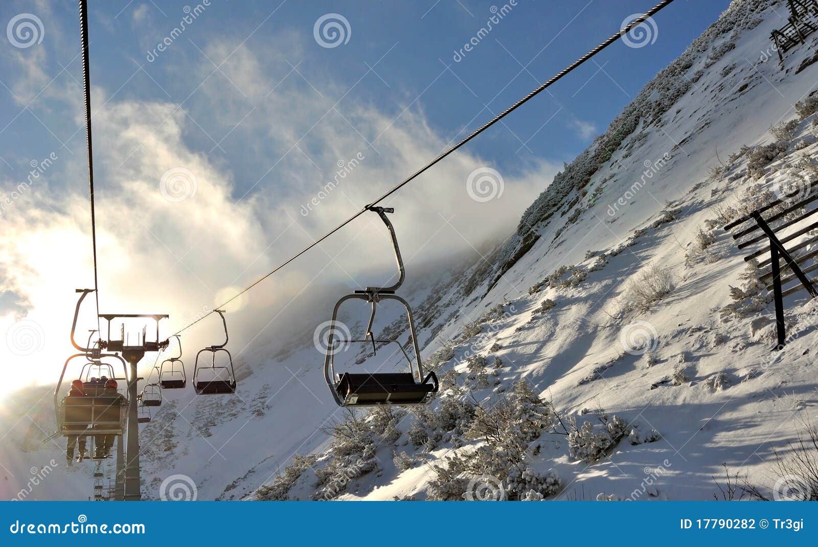 Double Ski Lift Carrying Skiers in Apls Stock Photo - Image of rope ...