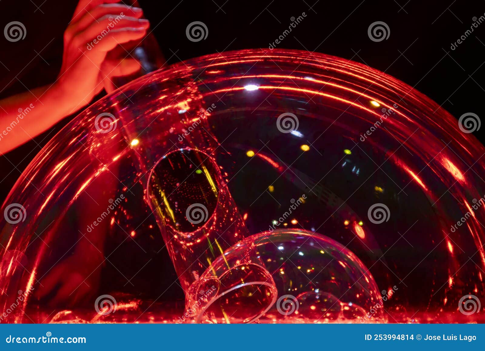 Double Soap Bubble Made with a Tube and Illuminated in Red Creating an ...