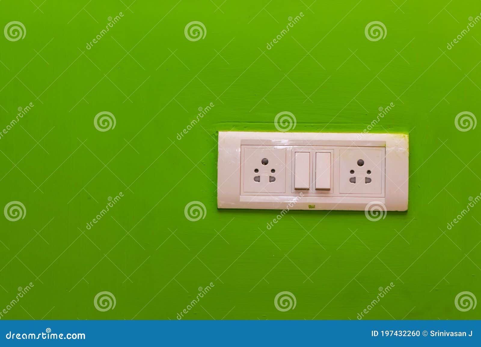 Double Sockets for Electrical Appliances on a Green Wall Background ...