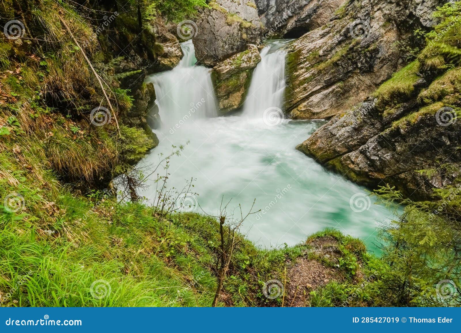 Double Waterfall with a Basin and Green Plants and Rocks Named ...