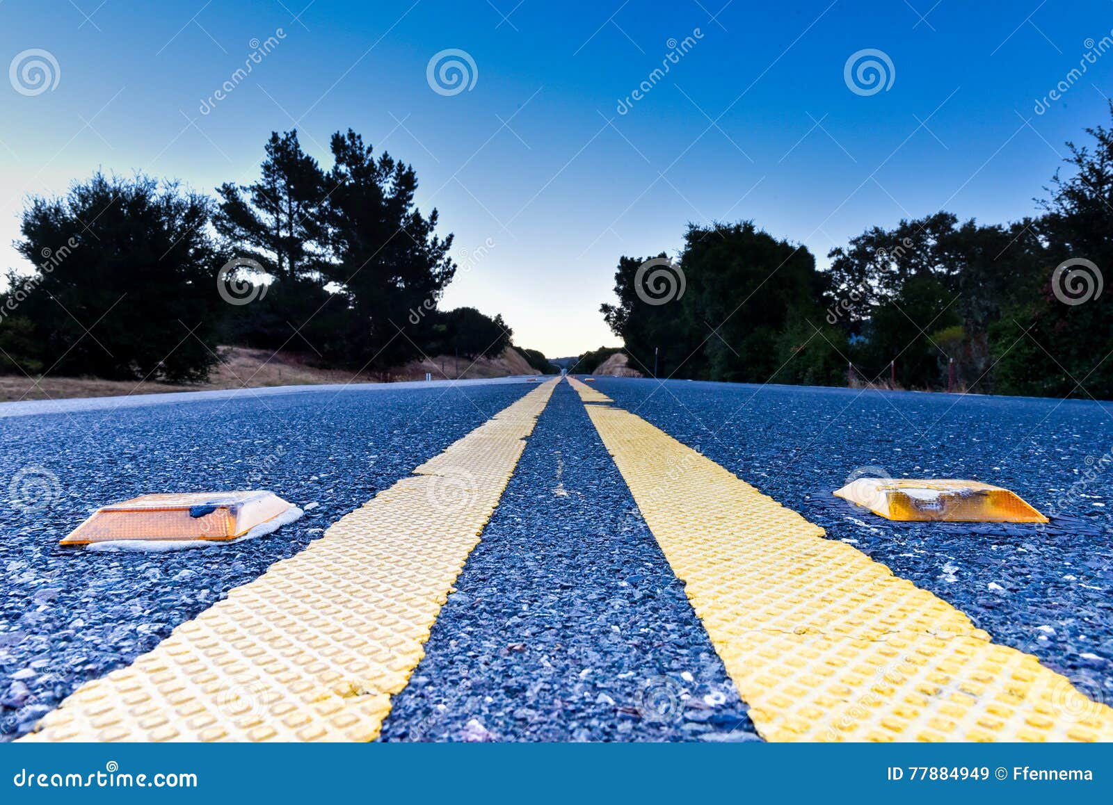 Double Yellow Line and Reflective Pavement Markers Stock Image - Image ...
