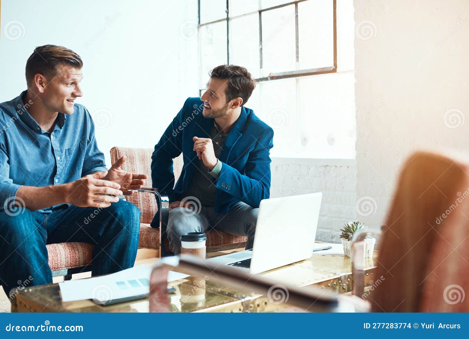 Doubled Up To Develop Something Awesome. Two Young Businessmen Having a ...