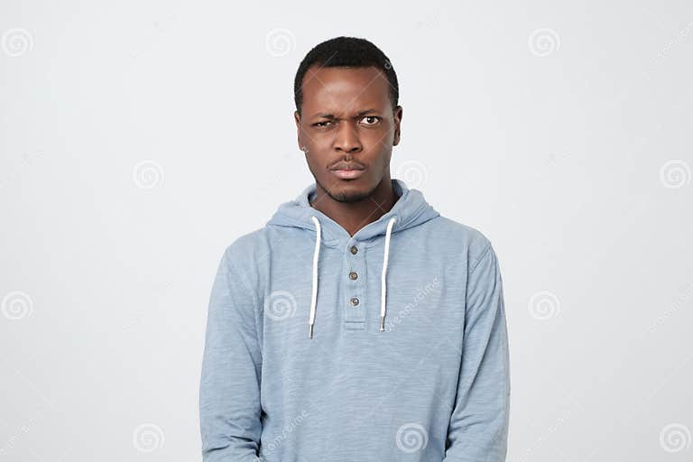 Doubtful African Man in Blue Pulover Looking with Disbelief Expression ...