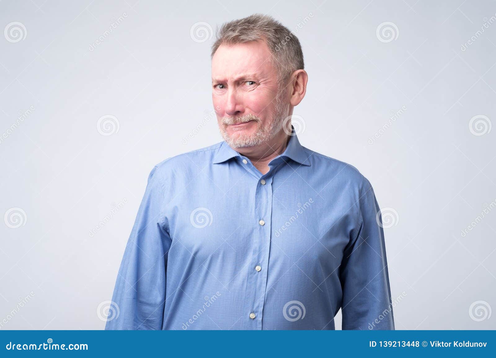 Senior Man in Blue Shirt Looking with Disbelief Expression . Stock ...