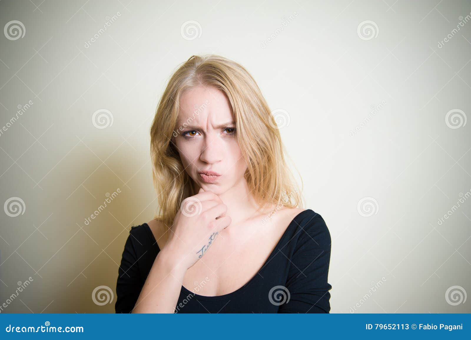 Doubtful Young Blonde Woman Portrait Stock Image - Image of doubtful ...