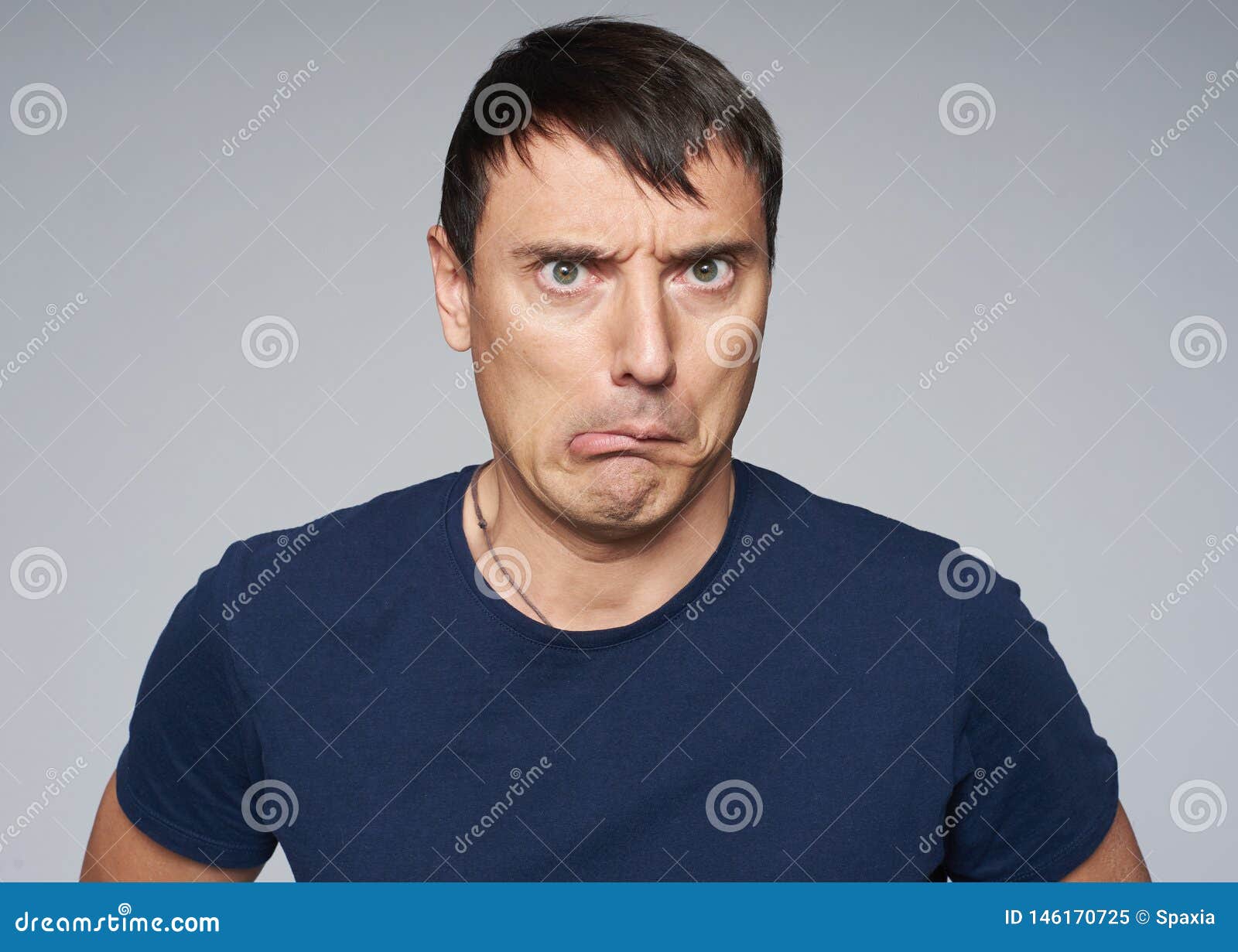 Doubtful young man face stock image. Image of serious - 146170725