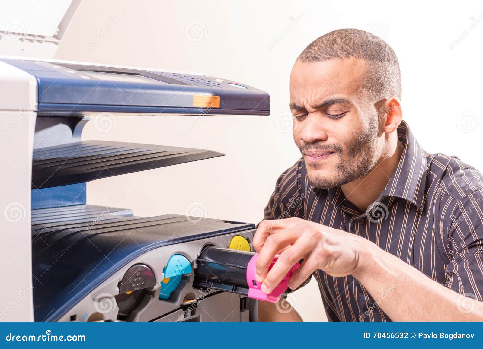 Doubting African Man Fixing Copier in the Office Stock Photo - Image of ...