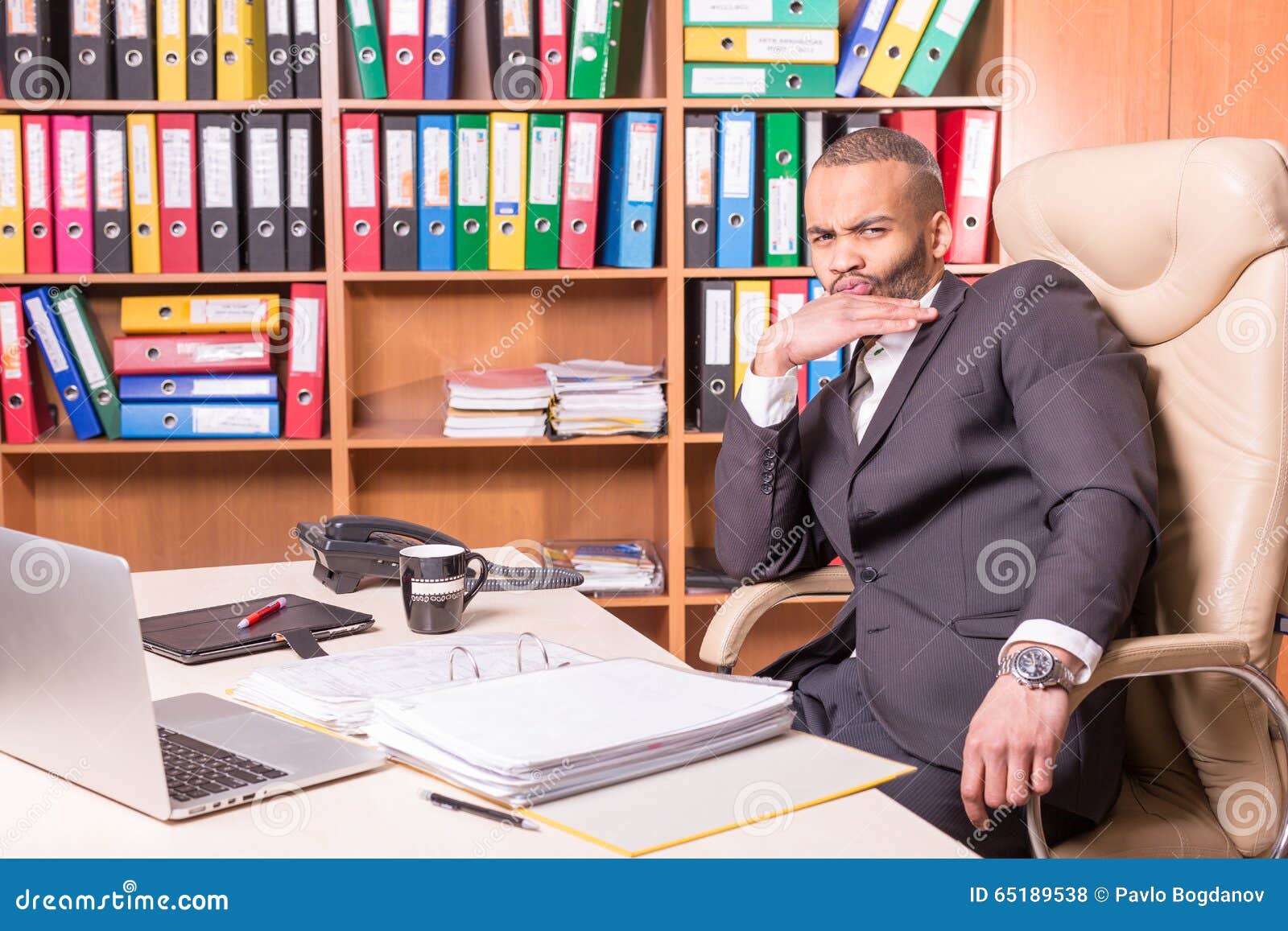 Doubting African Manager in Office Stock Photo - Image of male ...