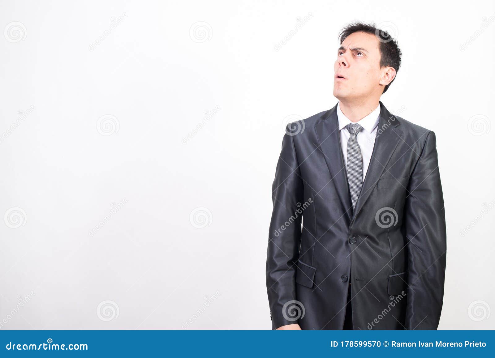 Doubting man in suit stock photo. Image of unsure, doubt - 178599570
