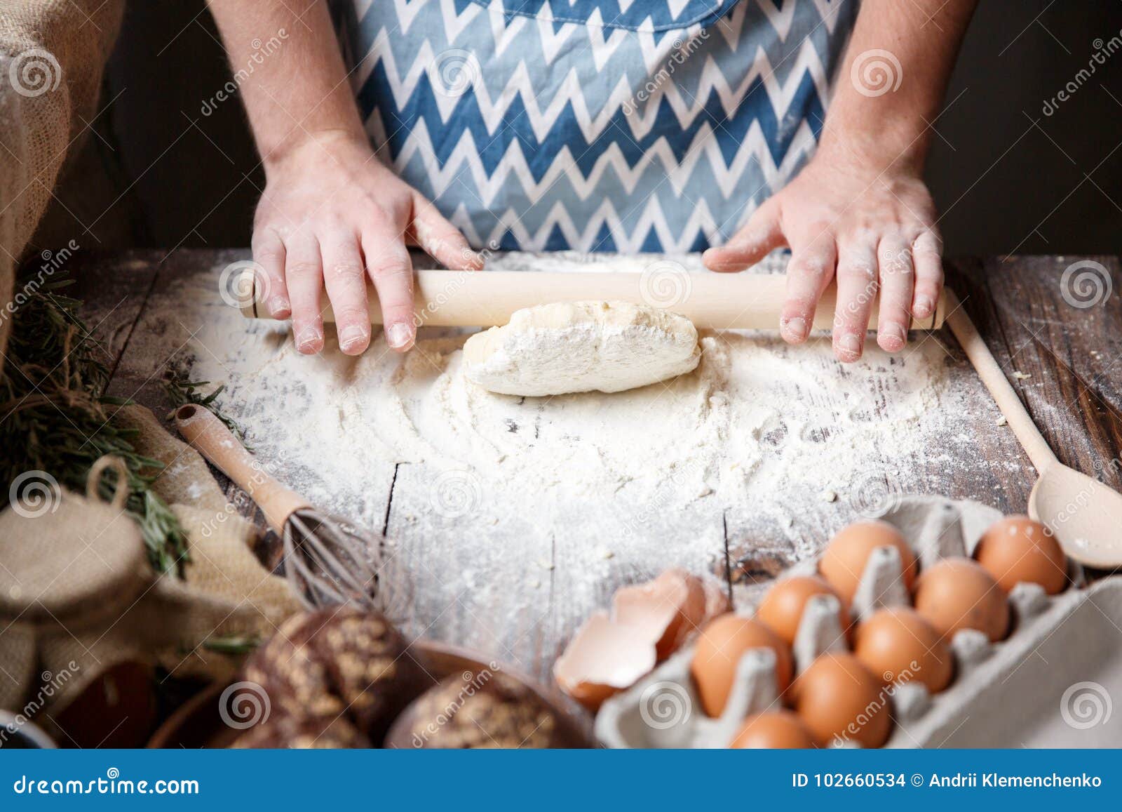 The Dough is Rolled on a Table Sprinkled with Flour. Stock Photo ...