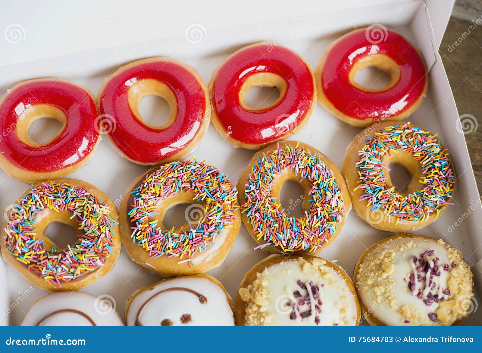 Doughnuts in a box stock image. Image of delicious, pink - 75684703