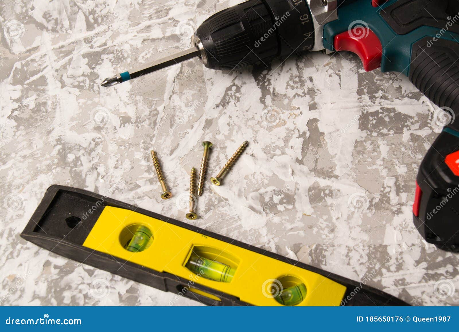 Dowel Screwdriver and Level on Concrete. Concept Advertising ...