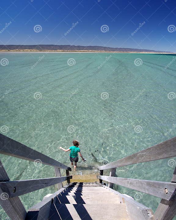 Down Jetty Steps for a Paddle Stock Image - Image of beautiful, coastal ...