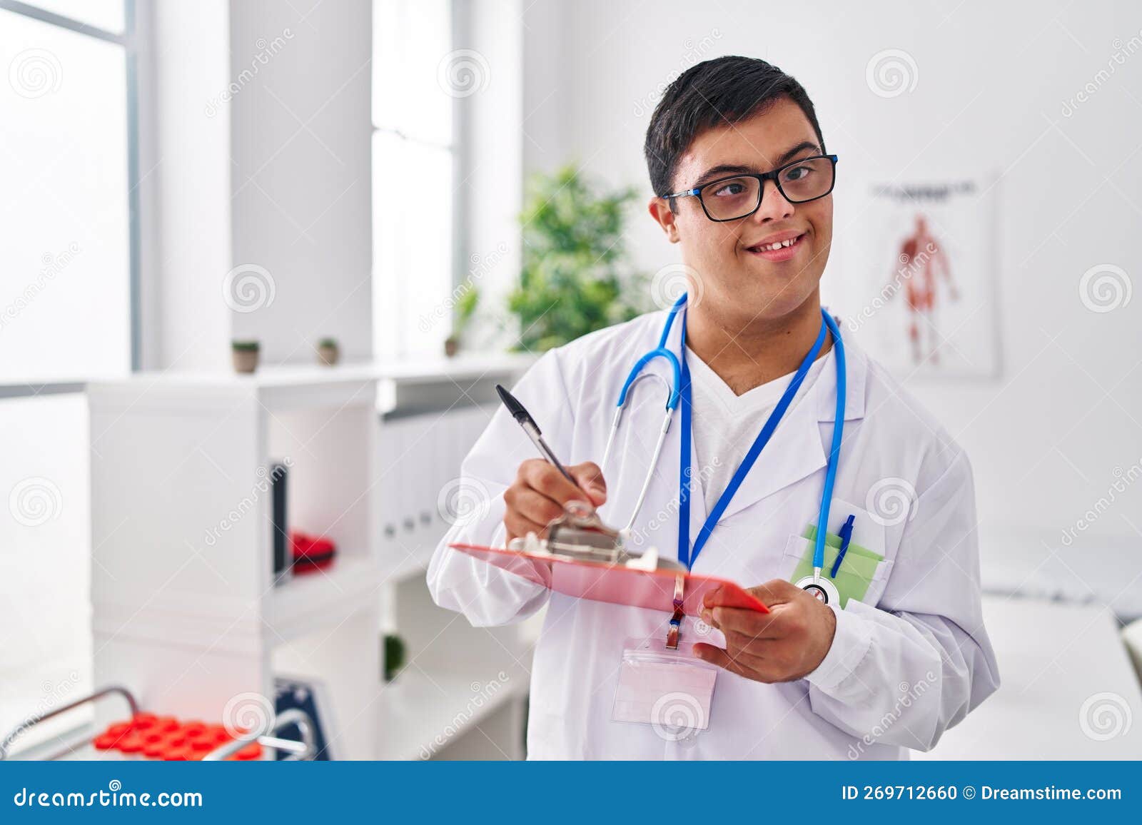 Down Syndrome Man Wearing Doctor Uniform Writing on Document at Clinic ...