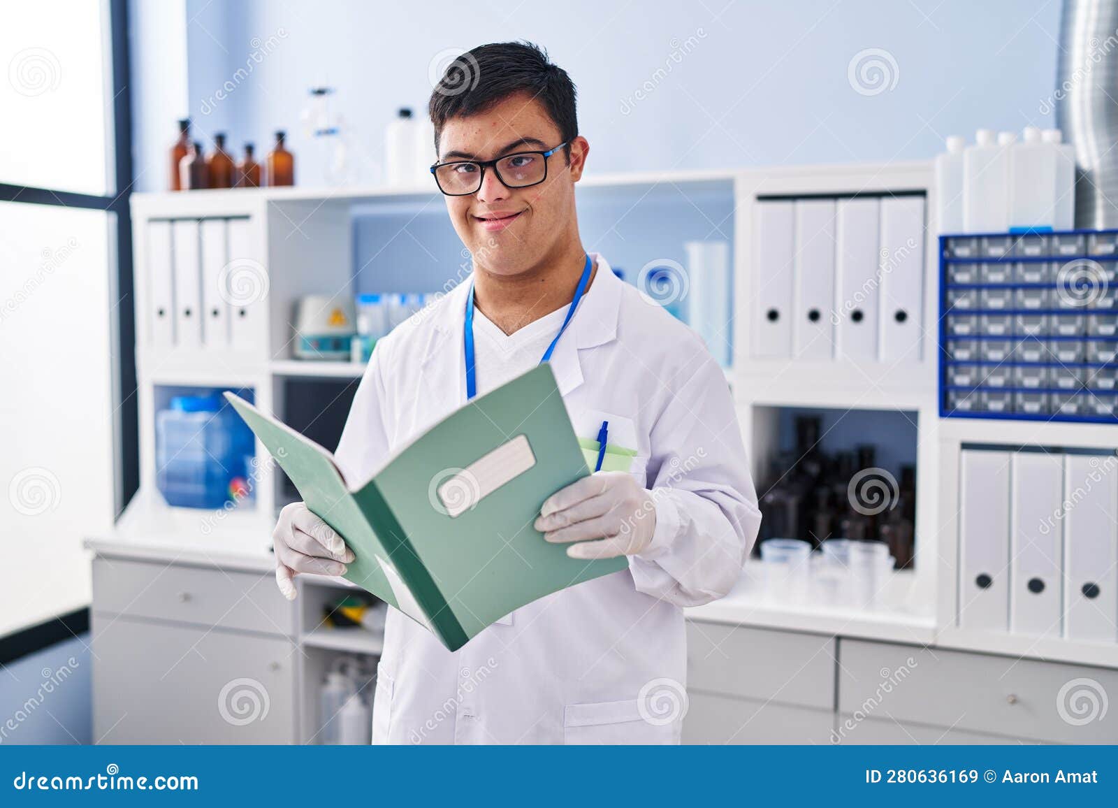 Down Syndrome Man Wearing Scientist Uniform Reading Notebook at ...