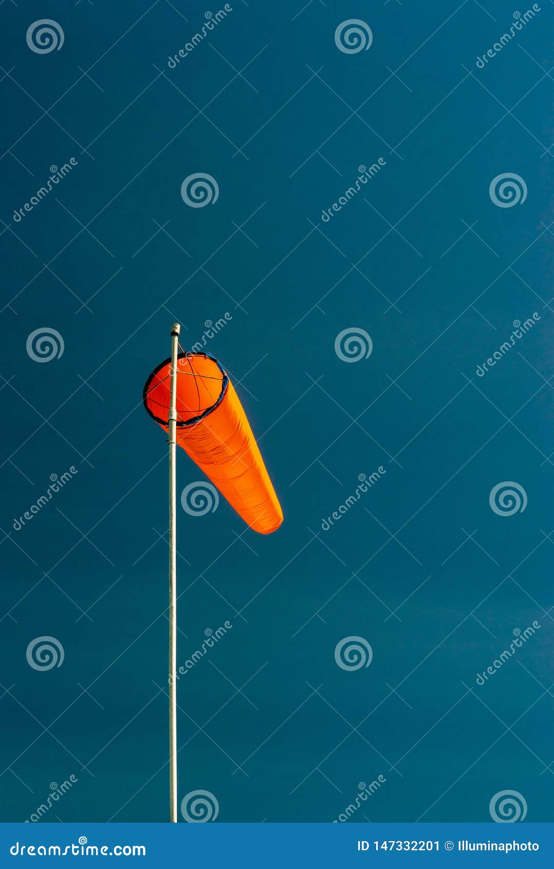 Downward Angled Plain Orange Windsock Against a Clear Blue Sky. Stock ...