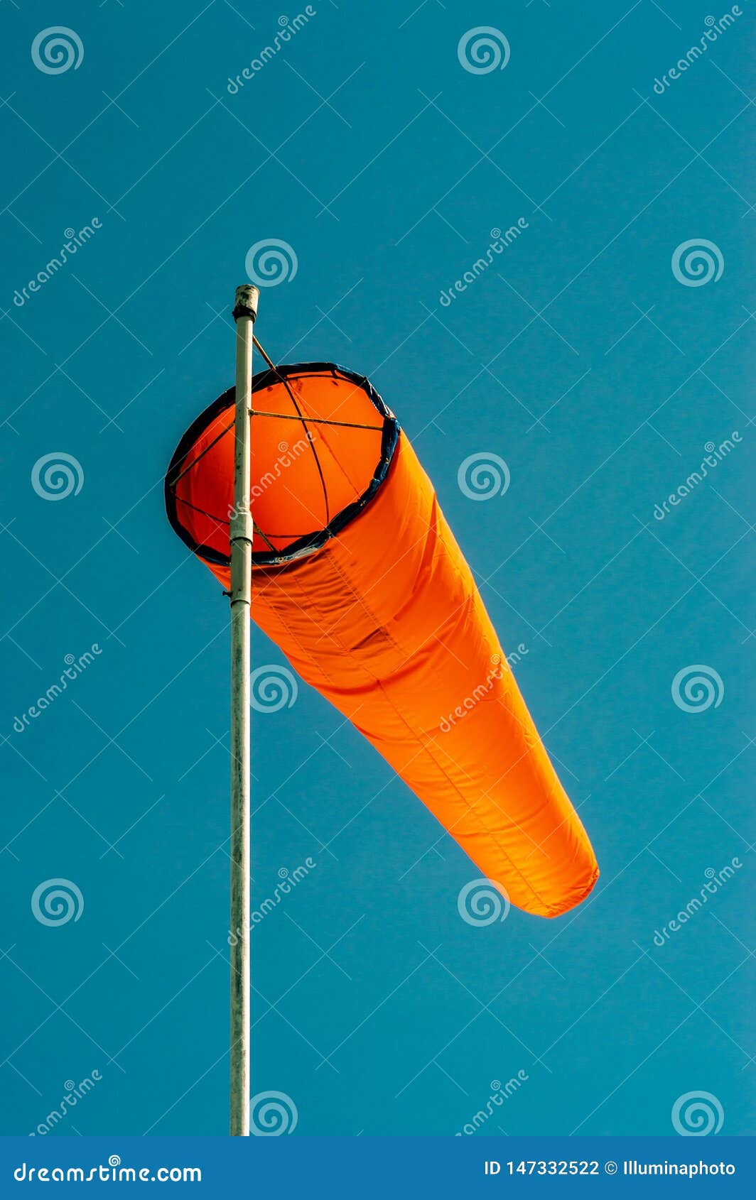 Downward Angled Plain Orange Windsock Against a Clear Blue Sky. Stock ...