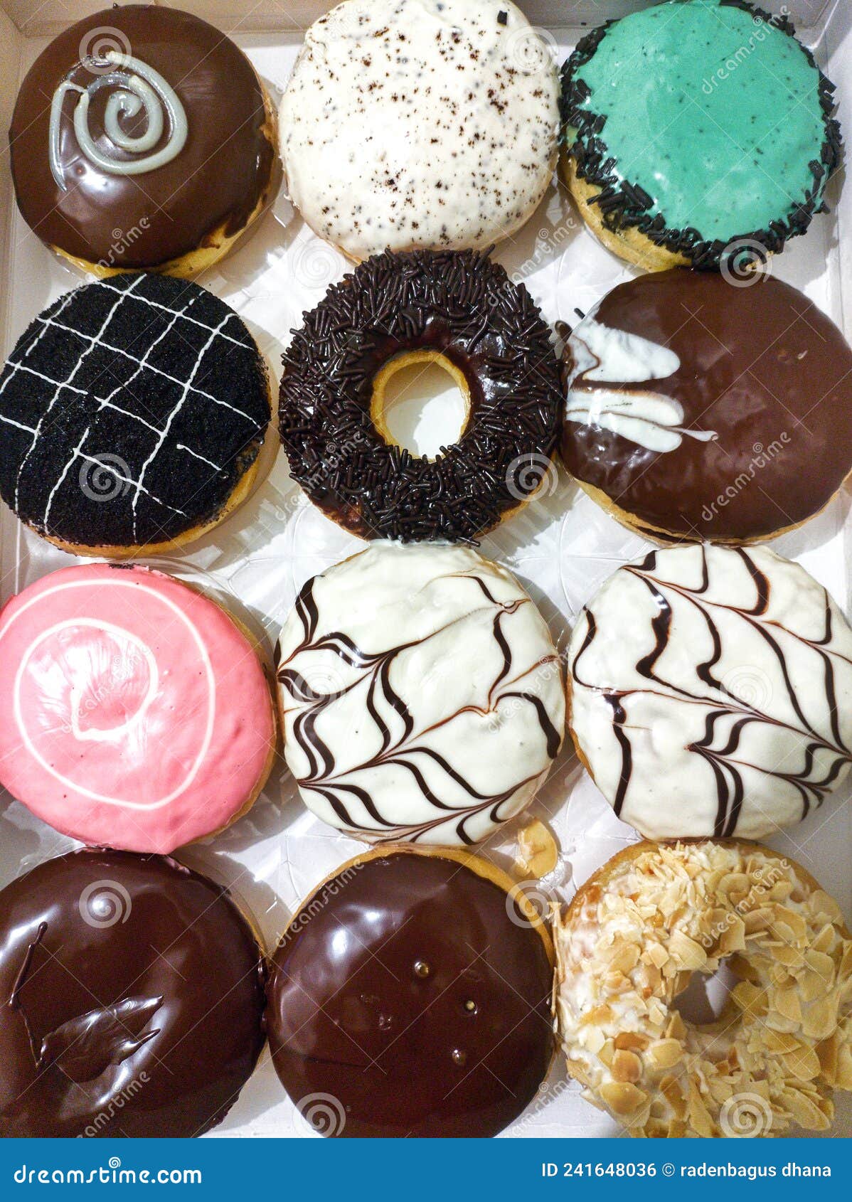 A Dozen of Donuts stock photo. Image of dozen, dessert - 241648036