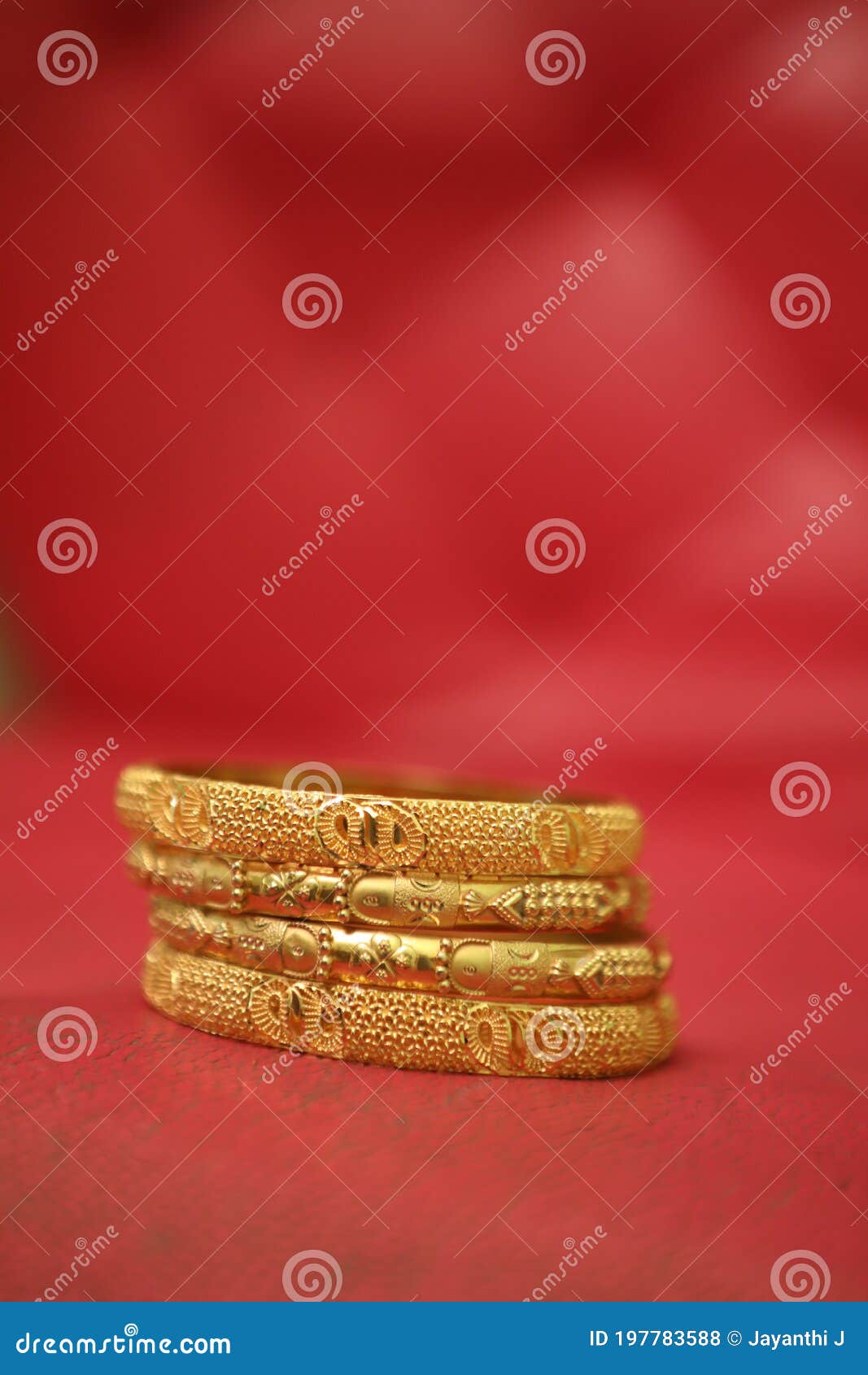 Dozens Of Gold Bangles Displayed On Brown Background Stock Photo ...