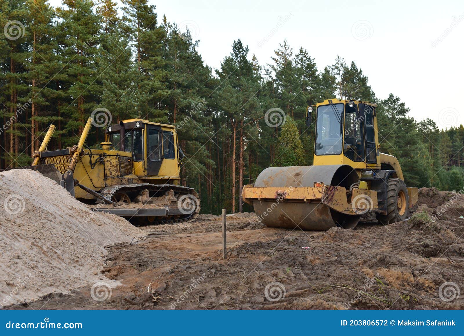 Dozer and Vibro Roller Soil Compactor at Road Construction and Bridge ...