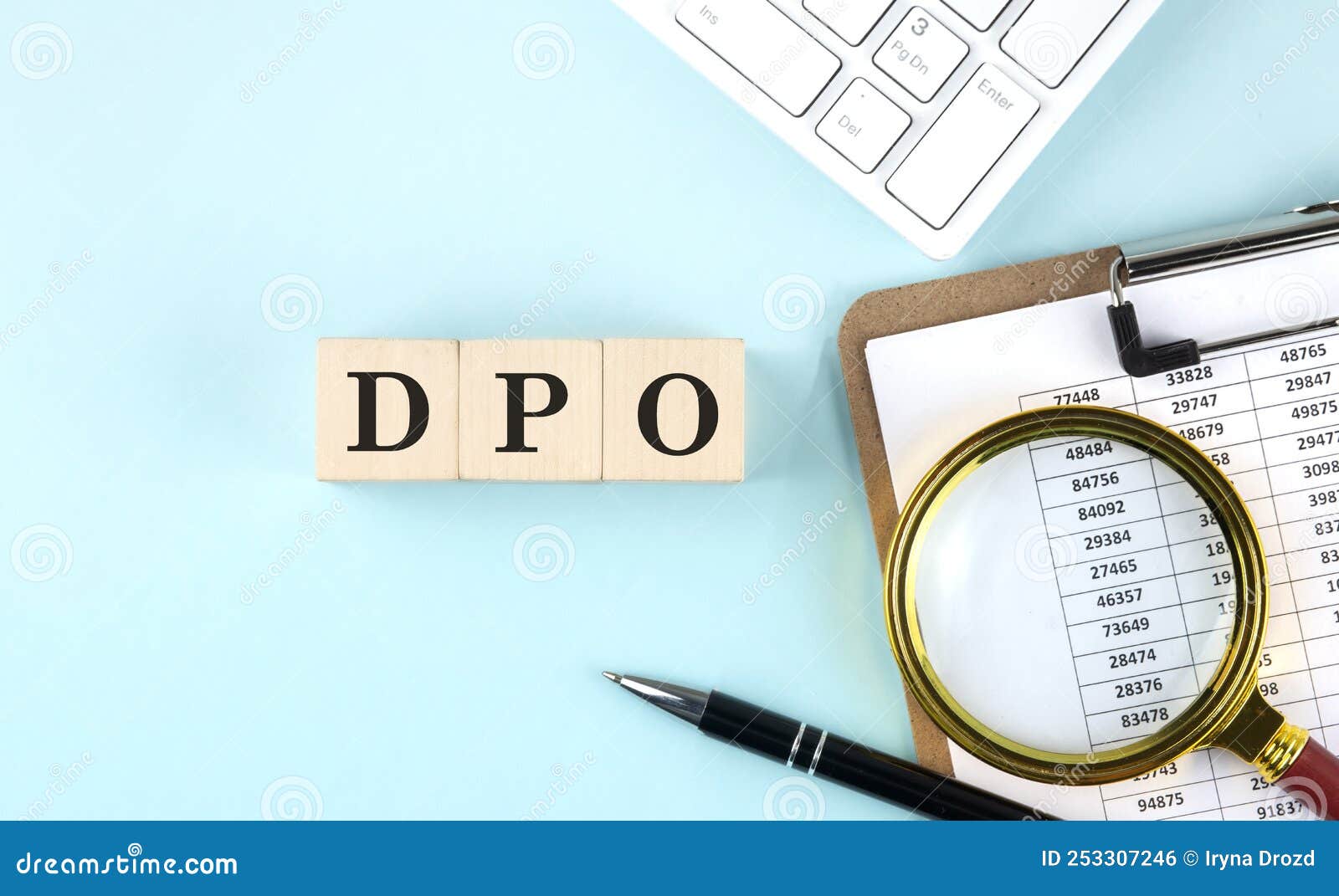 DPO Word on Wooden Cubes on Blue Background with Chart and Keyboard ...