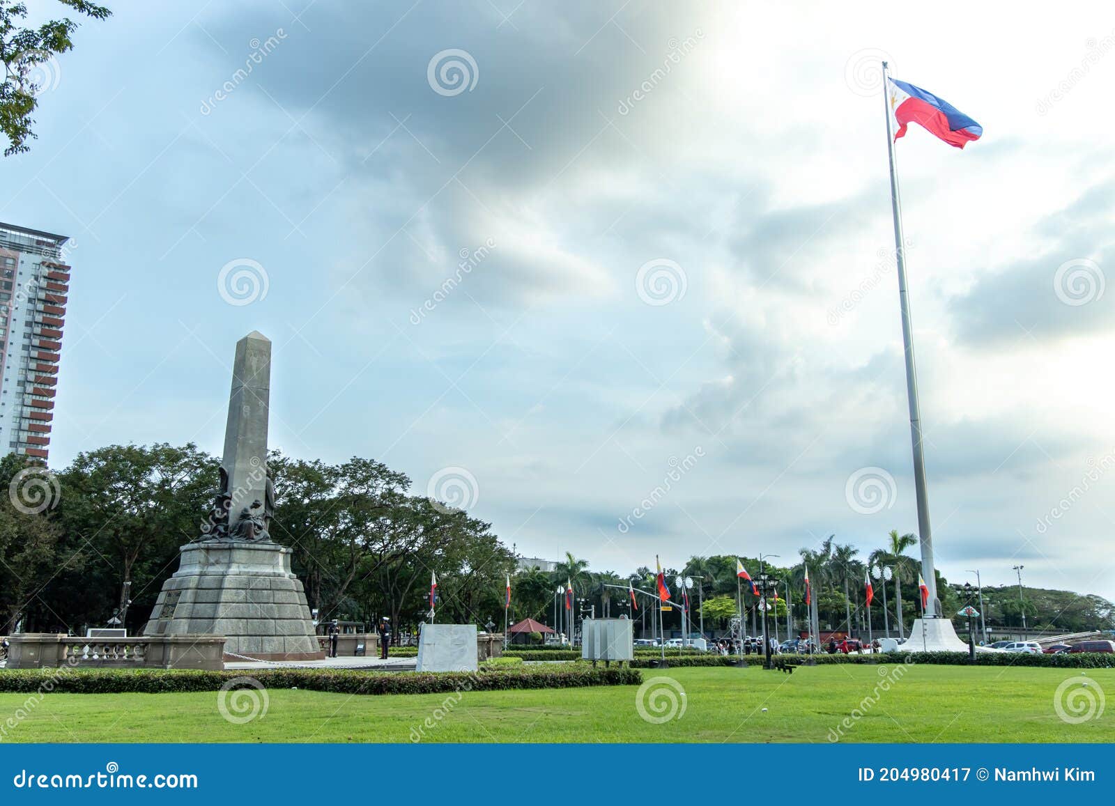 Dr. Jose Rizal National Monument and National Flags in the Wind, Manila ...