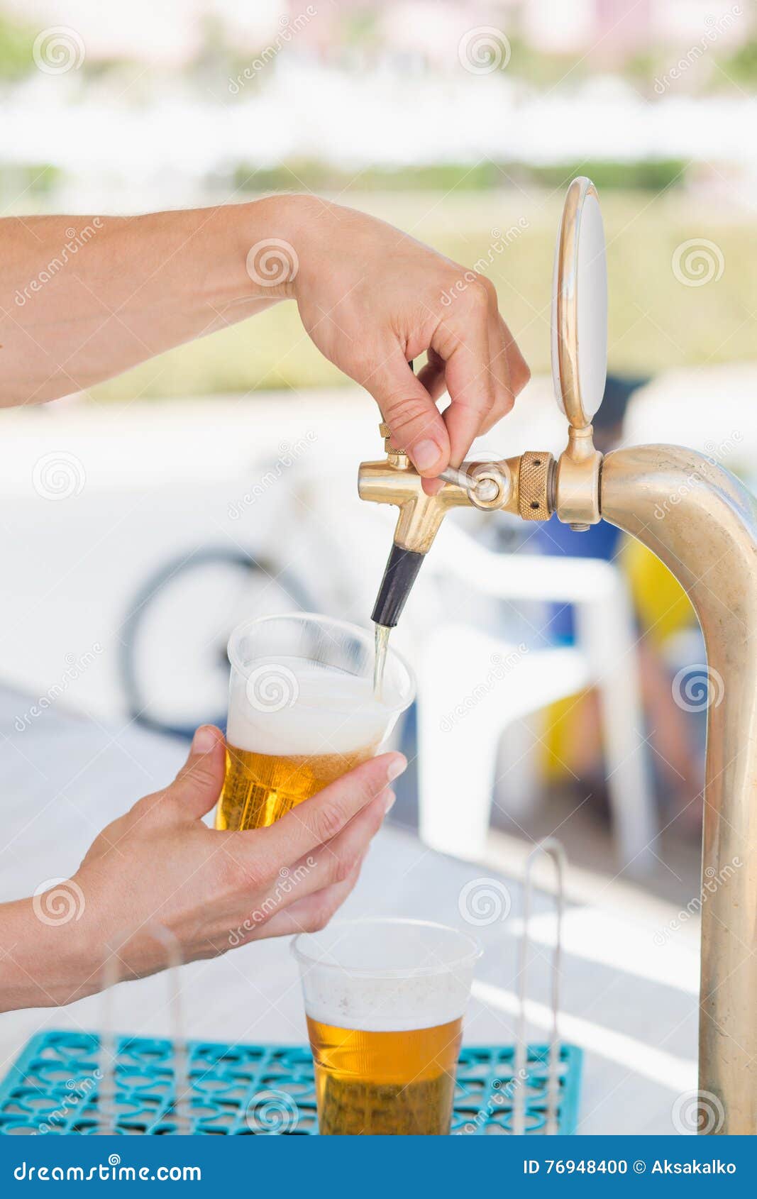 Draft beer pour stock photo. Image of full, hands, handles - 76948400