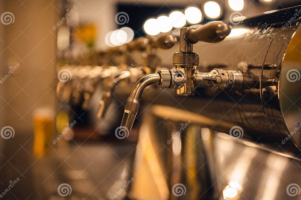 Draft Beer Taps in Modern Brewery, Side View. Stock Photo - Image of ...