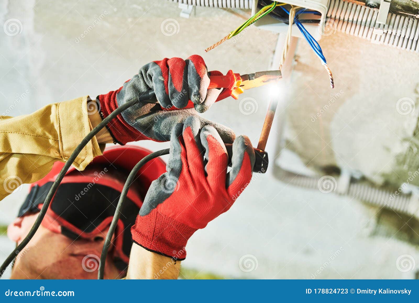 Electrician Service. Installer Melting Cable In Junction Box Royalty ...