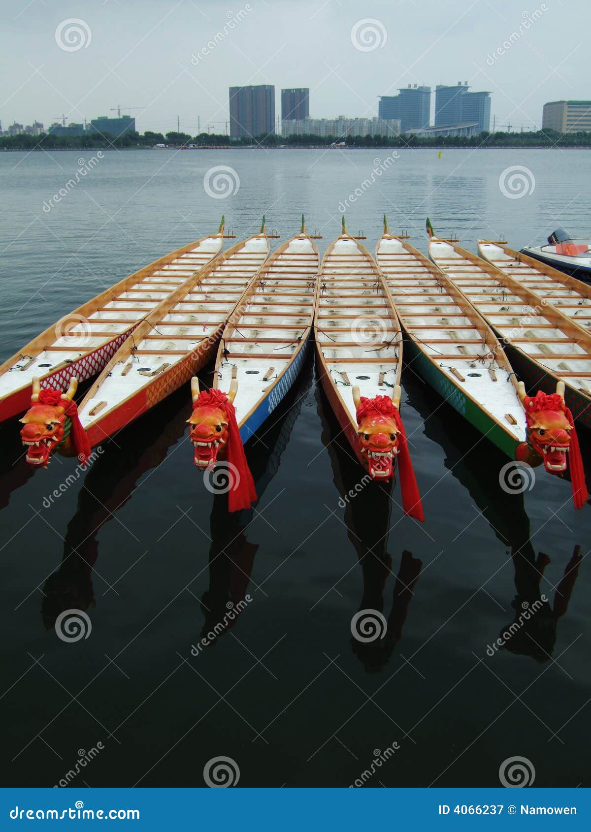 A Row Of Dragon Boats With The Traditional Figureheads Stock Photo ...