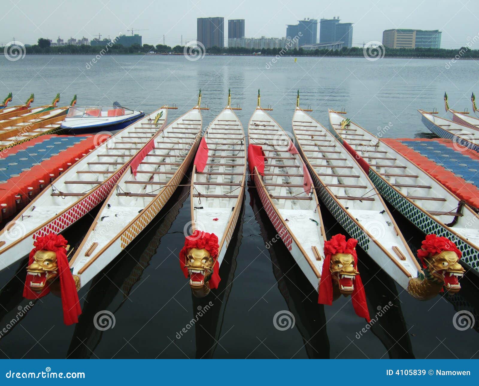 A Row Of Dragon Boats With The Traditional Figureheads Stock Photo ...