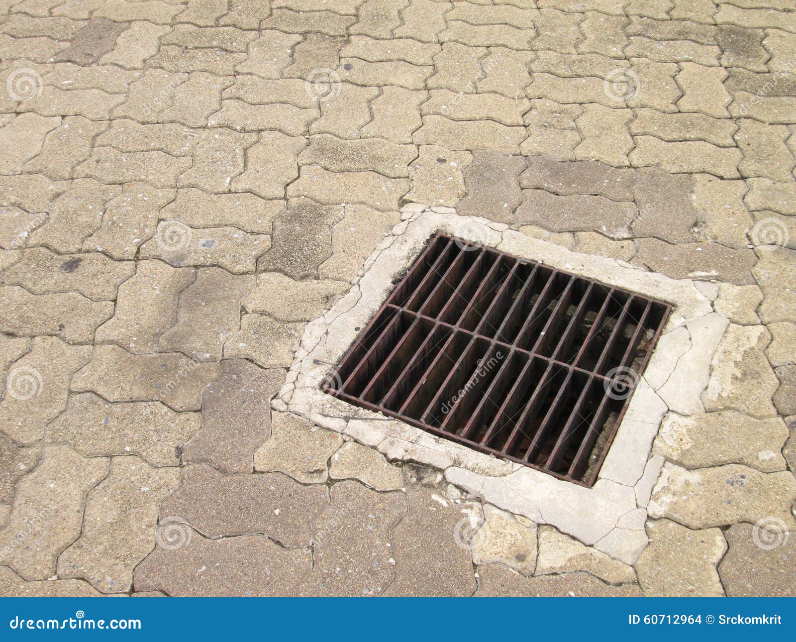 Drain on a brick walkway stock photo. Image of paved - 60712964