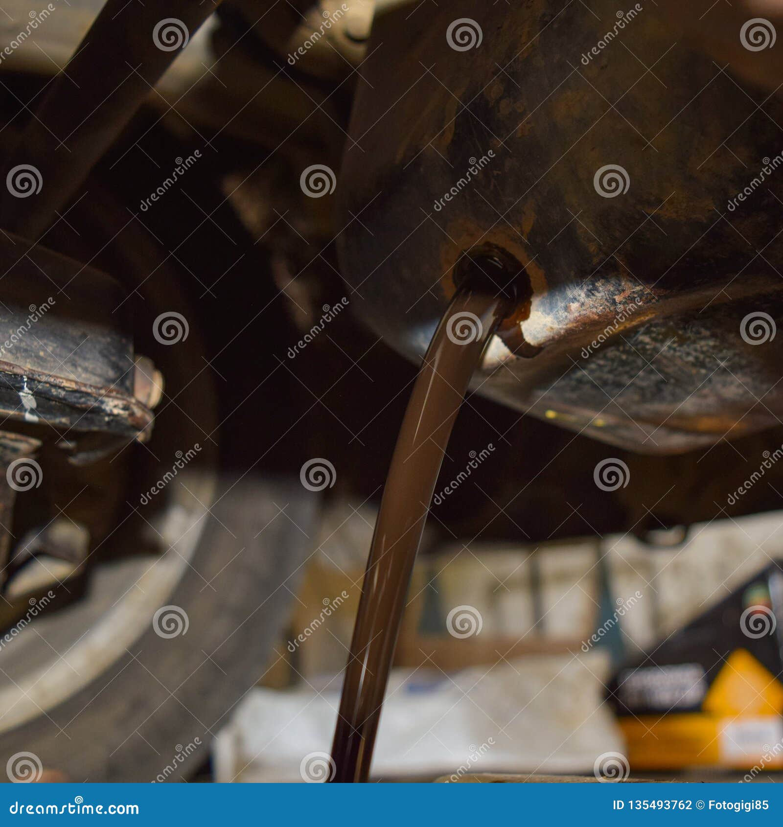 Drain the Old Oil from the Engine through the Drain Plug Stock Photo ...